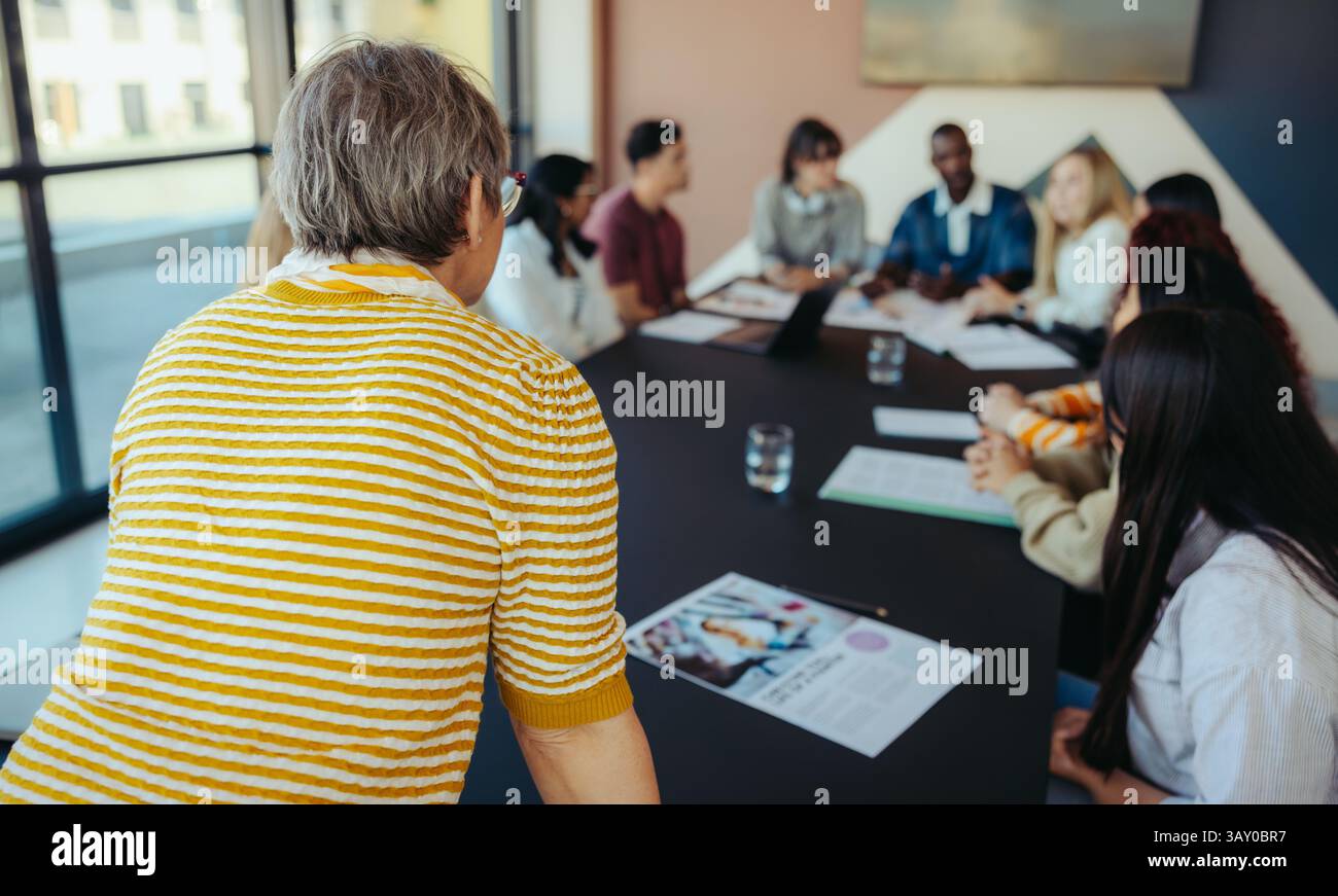 A lively university class in a city environment, where students are ...
