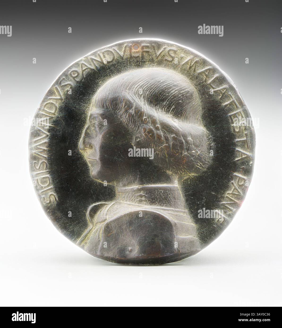 A round medallion featuring a detailed profile of a historical figure ...