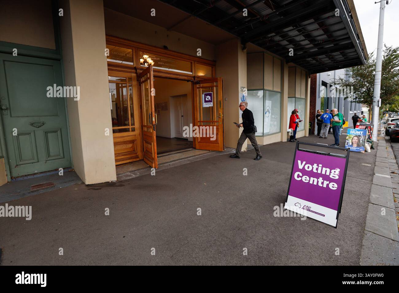 A man walks into the voting center during the early voting period for ...