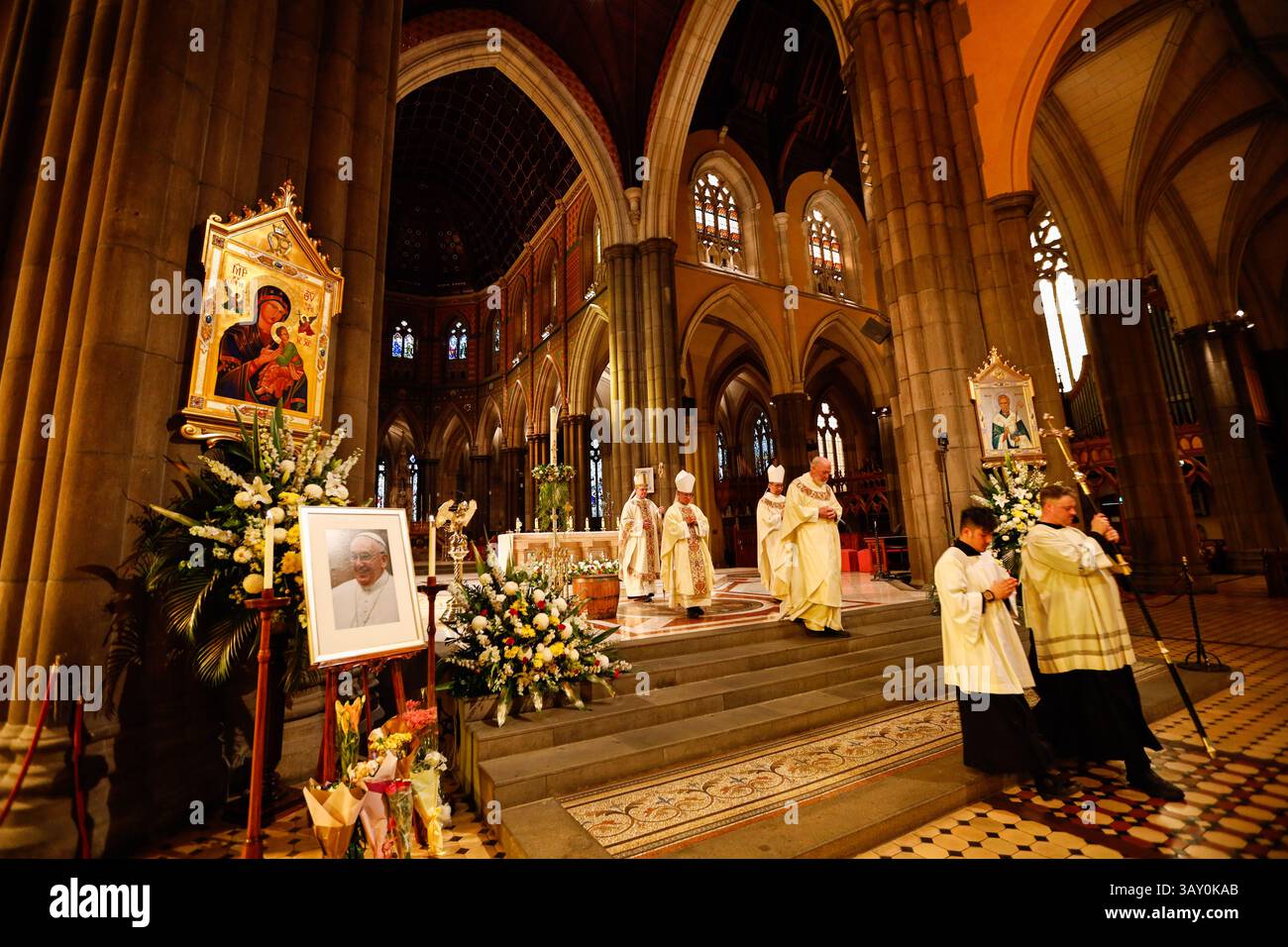 A priest leads the memorial Mass for Pope Francis at St Patrick's ...