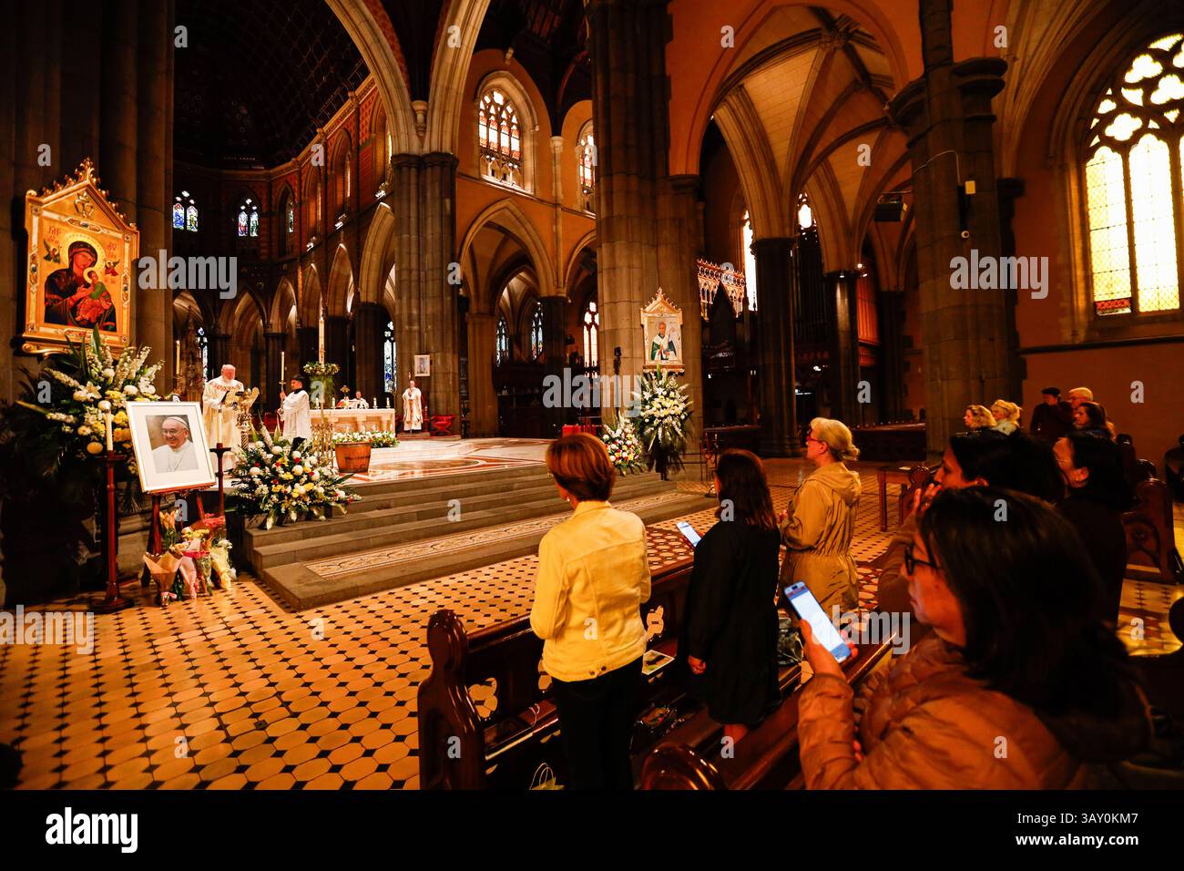 People gather in silence at St Patrick's Cathedral following news of ...