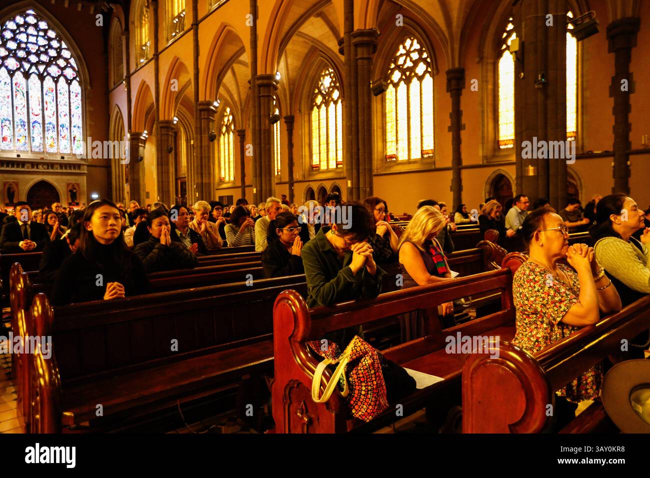 People gather in silence at St Patrick's Cathedral following news of ...