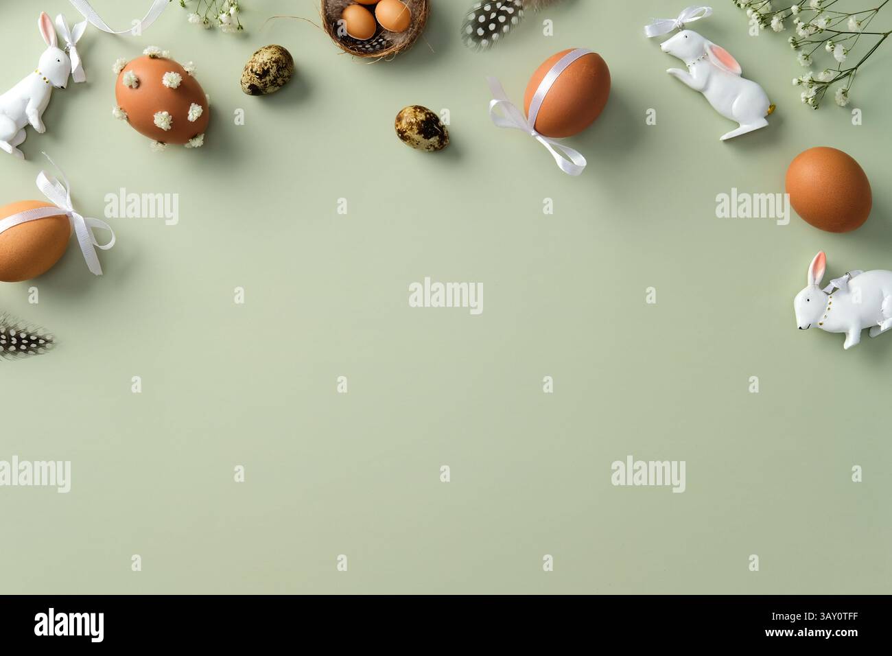 Easter flat lay composition with decorated eggs, ceramic bunnies ...