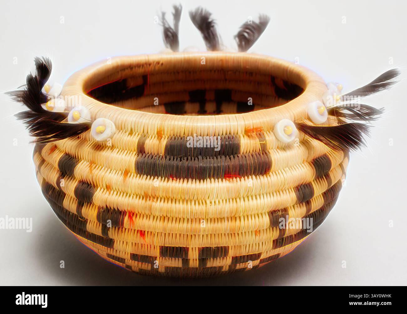 A beautifully crafted basket featuring intricate weaving patterns ...