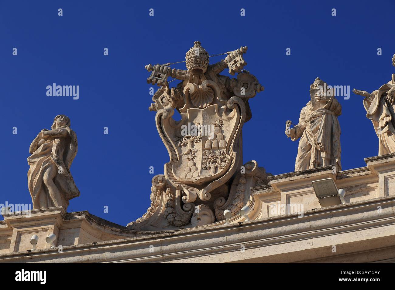Statues and sculpted papal symbols (keys, tiara,coat of arms) on the ...
