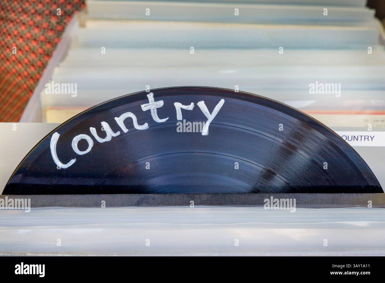 Vinyl turntable records on a flea market with the text Country written ...