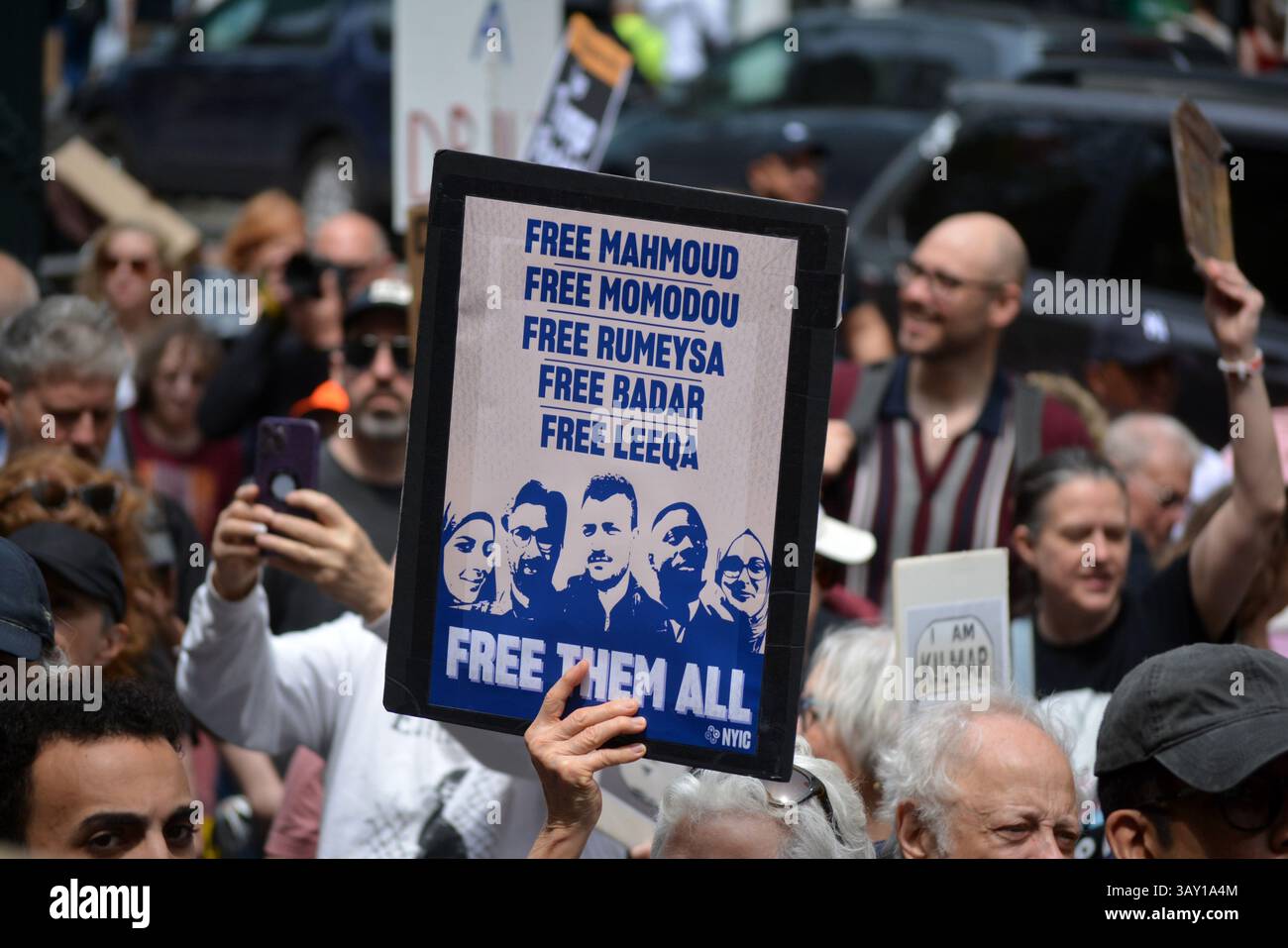 Demonstrators marching up Fifth Avenue to protest the Trump ...