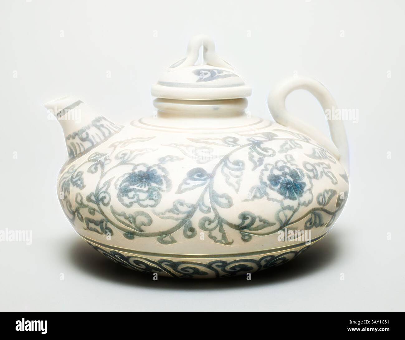 An intricately designed teapot featuring elegant floral patterns in ...
