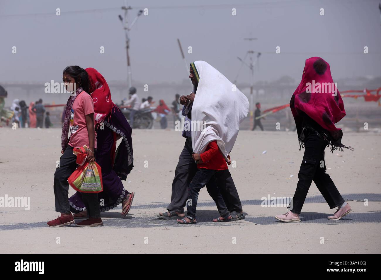 Prayagraj, India. 22 April 2025, people brave heat wave conditions ...