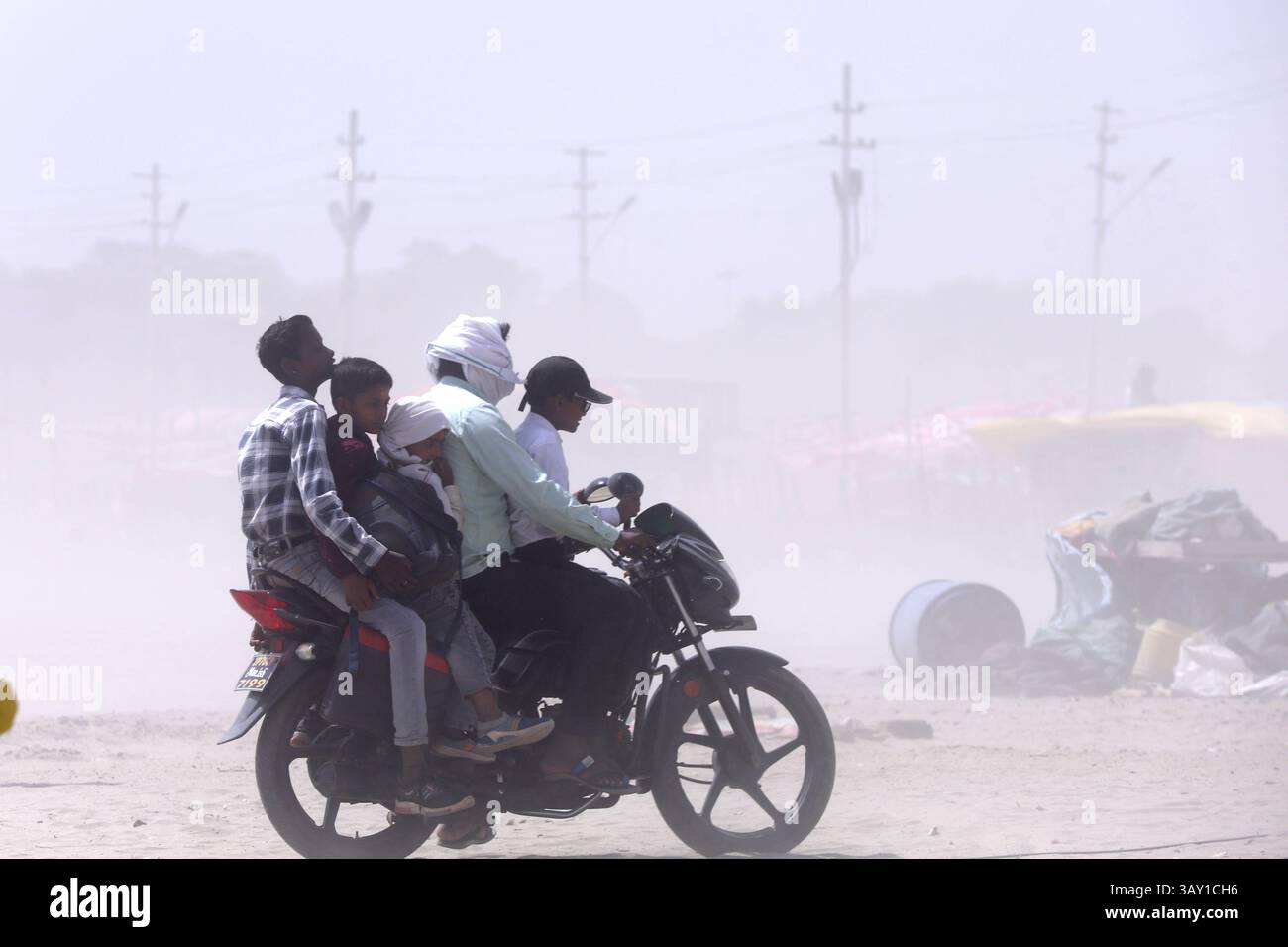 Prayagraj, India. 22 April 2025, people brave heat wave conditions ...