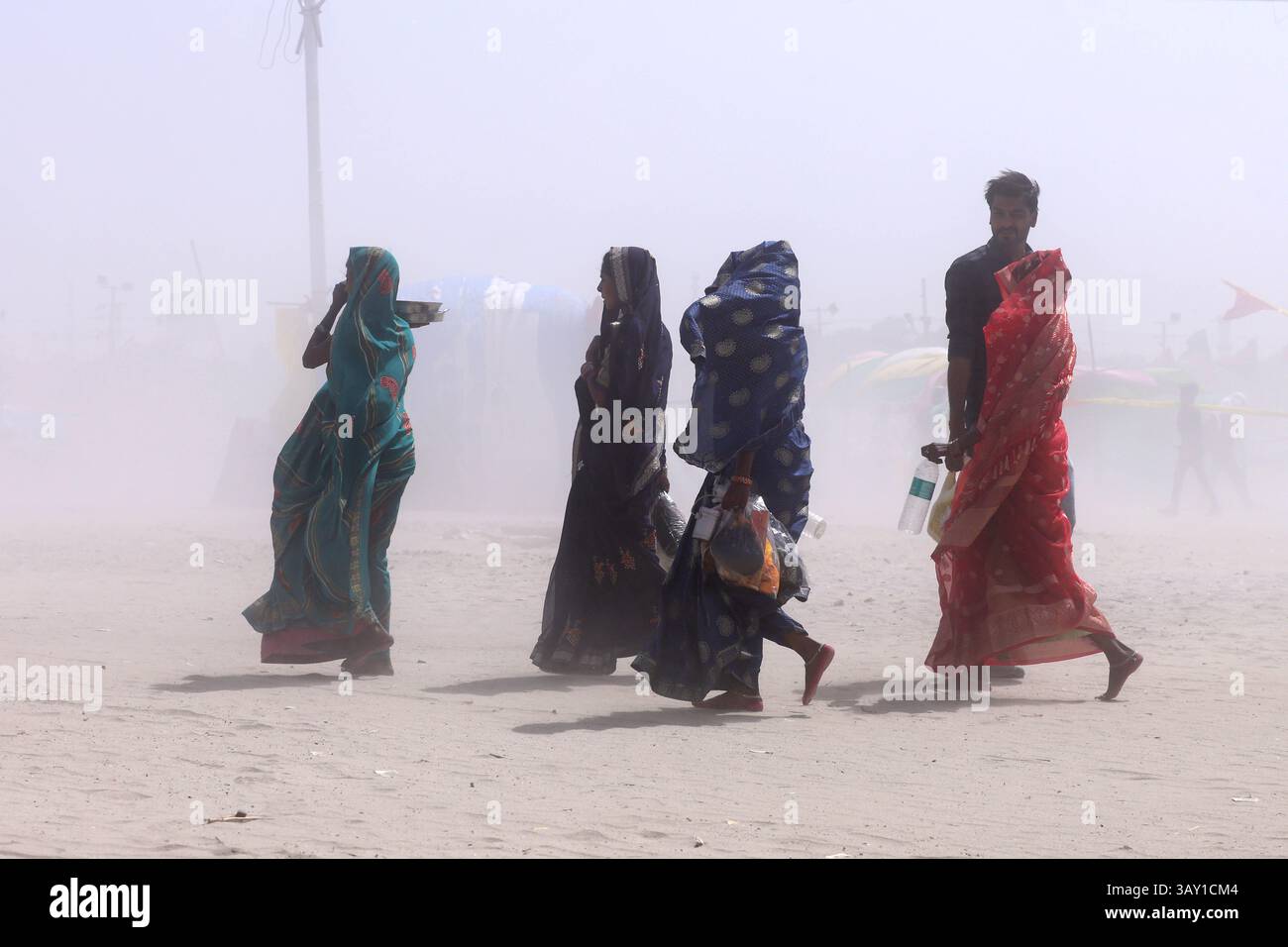 Prayagraj, India. 22 April 2025, people brave heat wave conditions ...