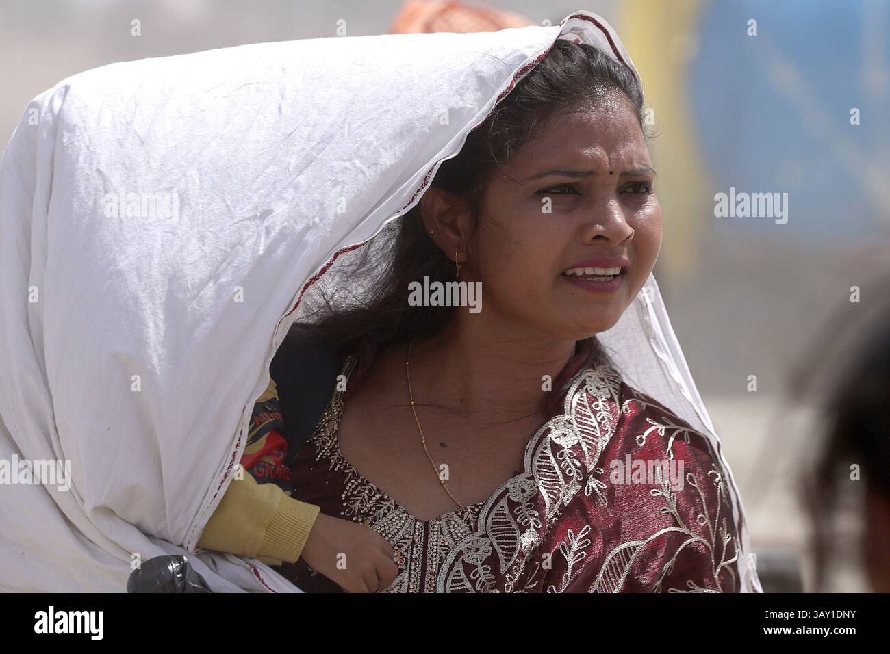 Prayagraj, India. 22 April 2025, people brave heat wave conditions ...