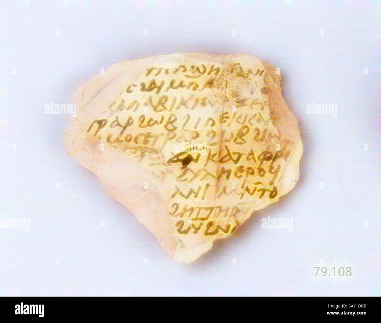 A fragment of pottery inscribed with ancient Greek text, showcasing ...