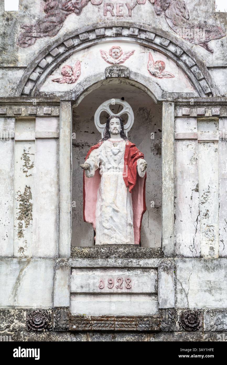 The Christ the King statue stands atop the pediment of St John ...