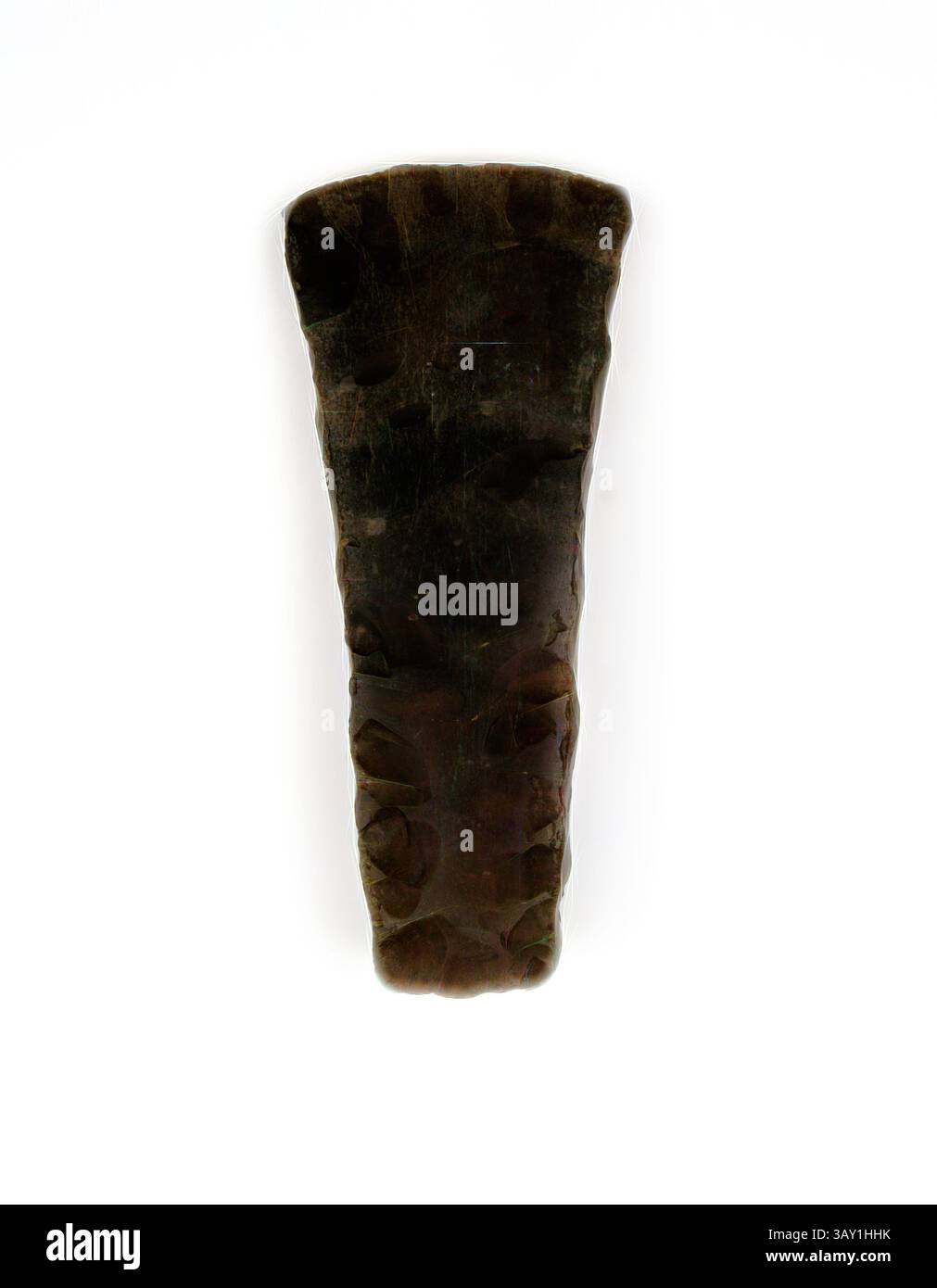 An intricately carved artifact featuring a tapered shape and detailed ...