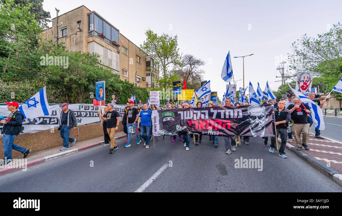 Haifa, Israel - April 19, 2025: People with various signs and flags ...