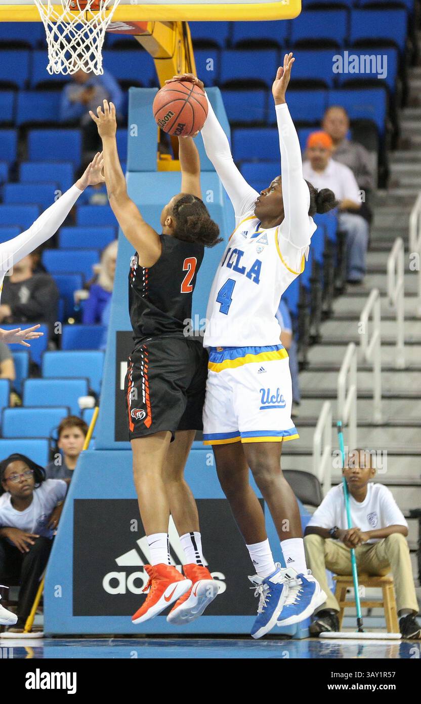 November 11, 2016: UCLA's Ashley Hearn #4 blocks the shot of Pacific's ...