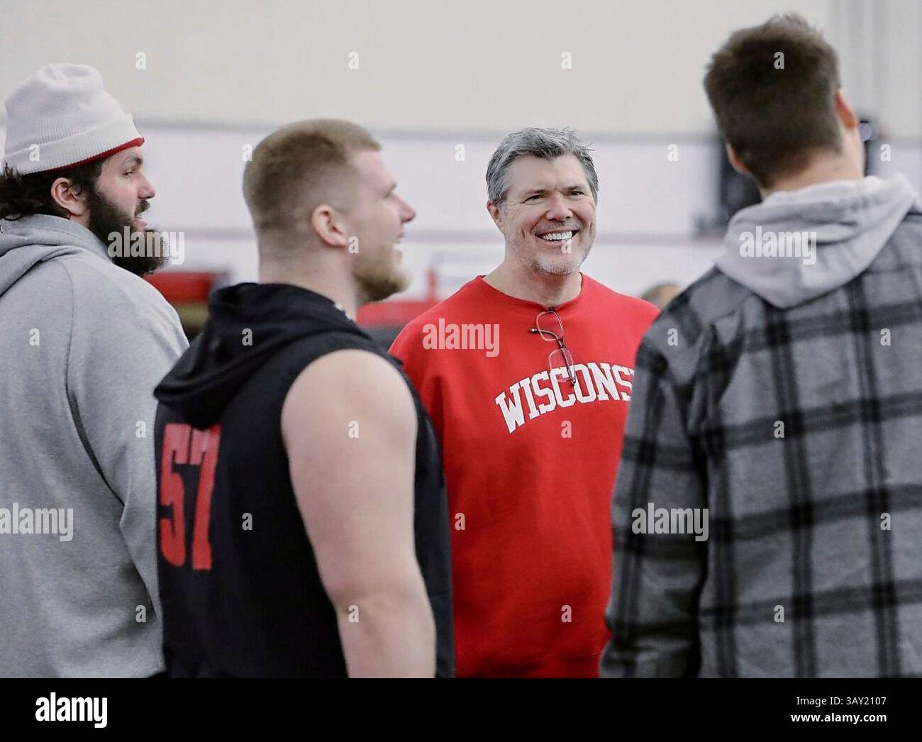 Wisconsin football offensive coordinator Jeff Grimes, middle, talks ...