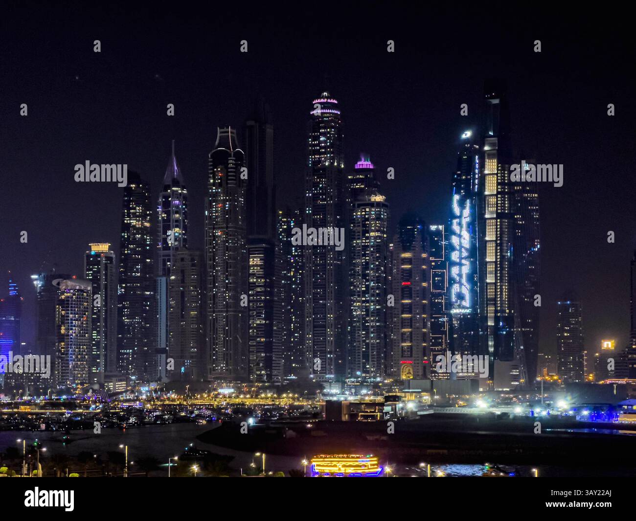 Dubai, UAE - December 31, 2024: Dubai’s skyscrapers light up the night ...