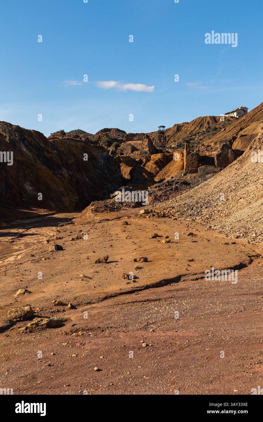 Vertical view of oxidized mining valley and scattered ruins at Mazarrón ...