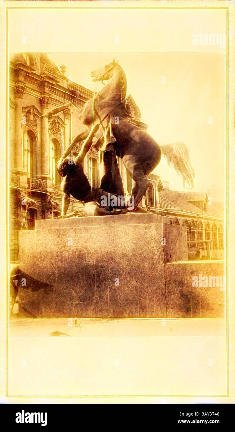 A majestic statue of a rearing horse atop a pedestal, with a figure ...