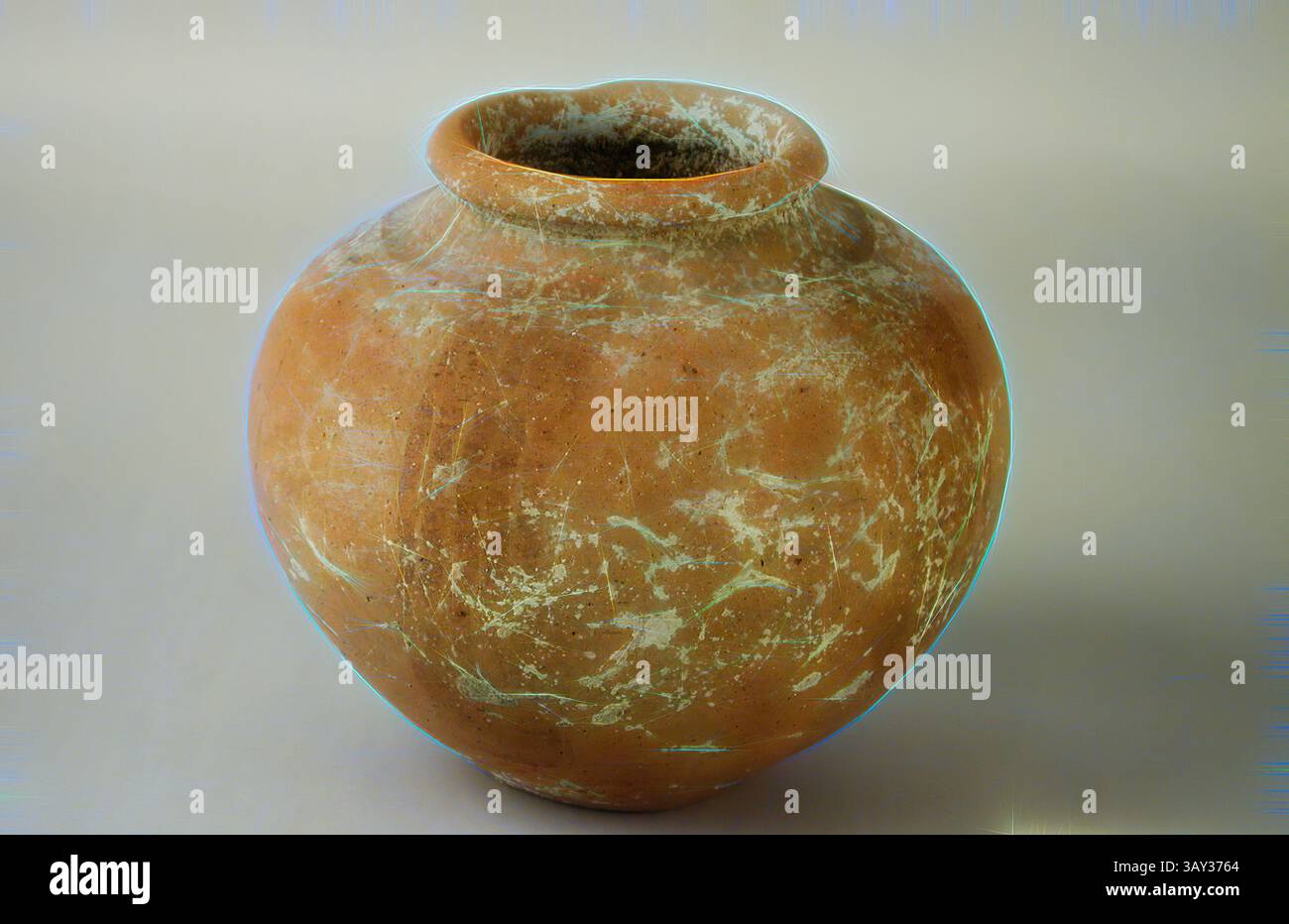 An elegantly shaped pottery vessel featuring a rounded body and an open ...