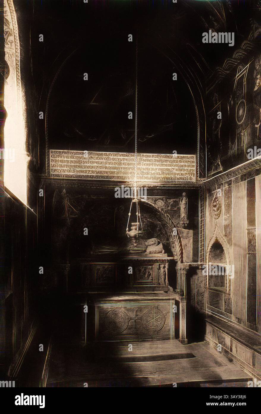 A dimly lit interior featuring intricate frescoes and detailed carvings ...