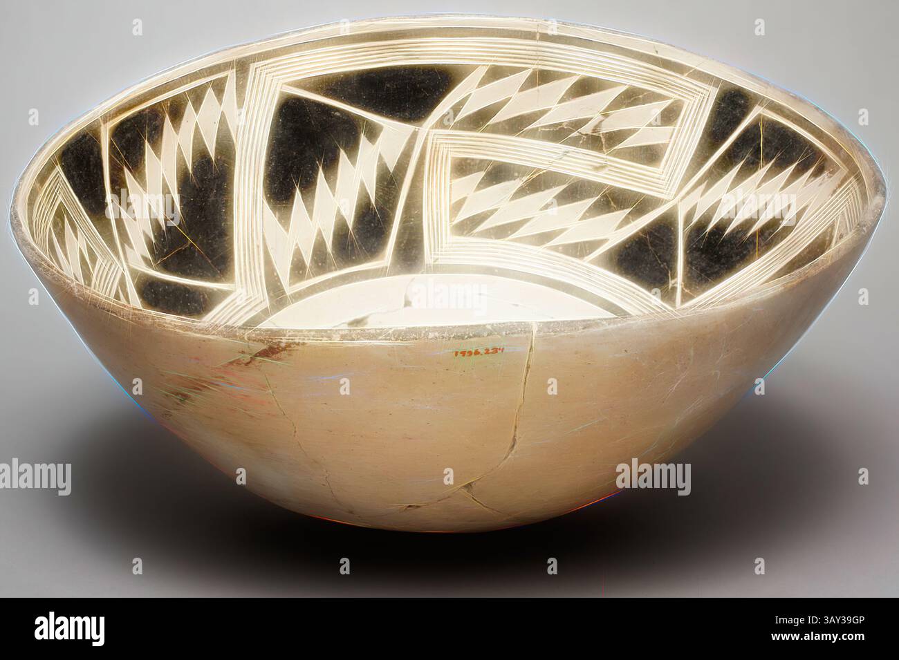 A beautifully crafted ceramic bowl featuring intricate geometric ...