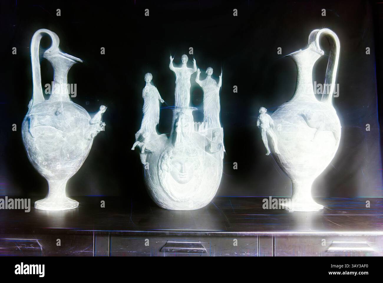 A striking arrangement of three artistic vases, each featuring ...