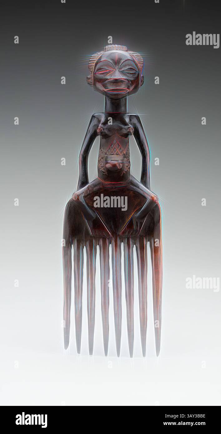 An intricately carved wooden comb features a seated female figure atop ...