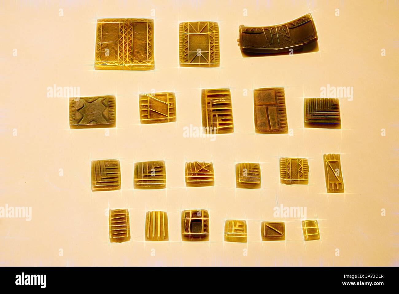 A collection of ancient clay tablets featuring intricate inscriptions ...