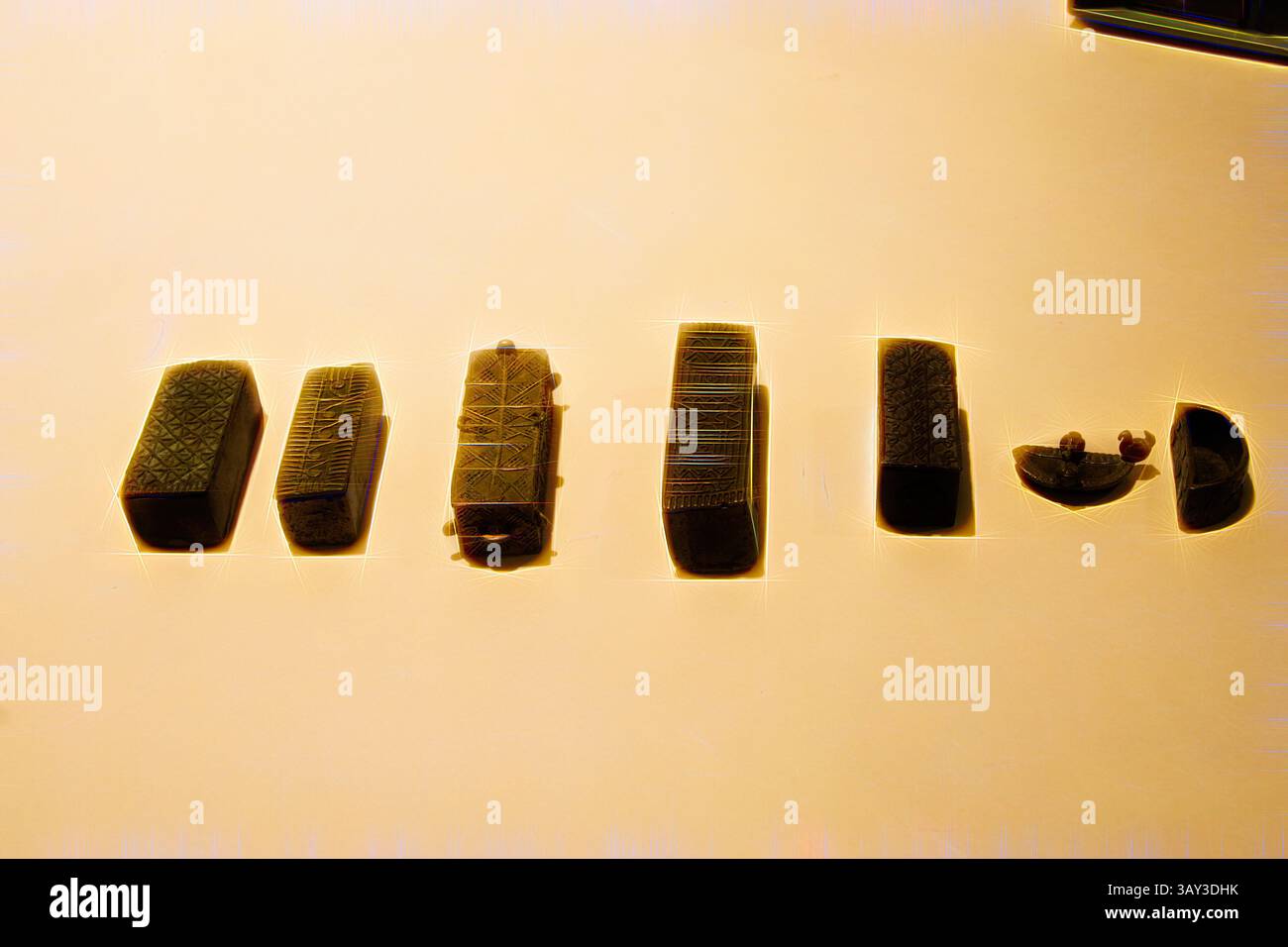 A collection of intricately carved stone artifacts, each showcasing ...