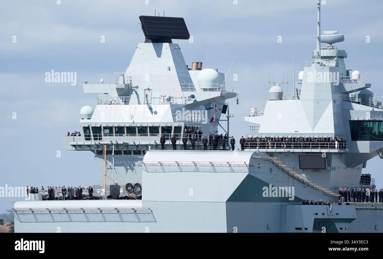The Royal Navy aircraft carrier, HMS Prince of Wales, sails from ...
