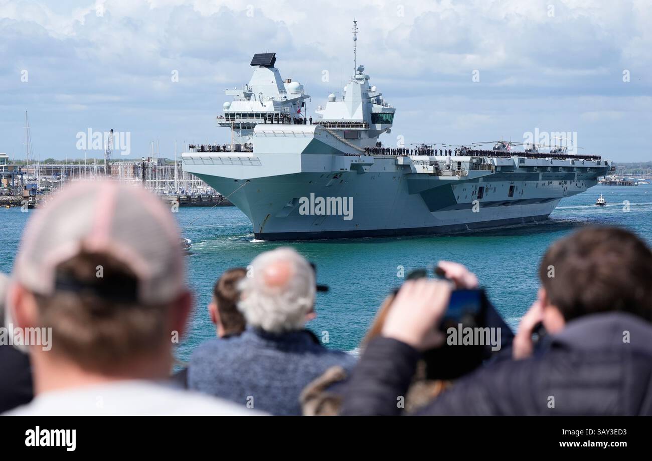 The Royal Navy aircraft carrier, HMS Prince of Wales, sails from ...
