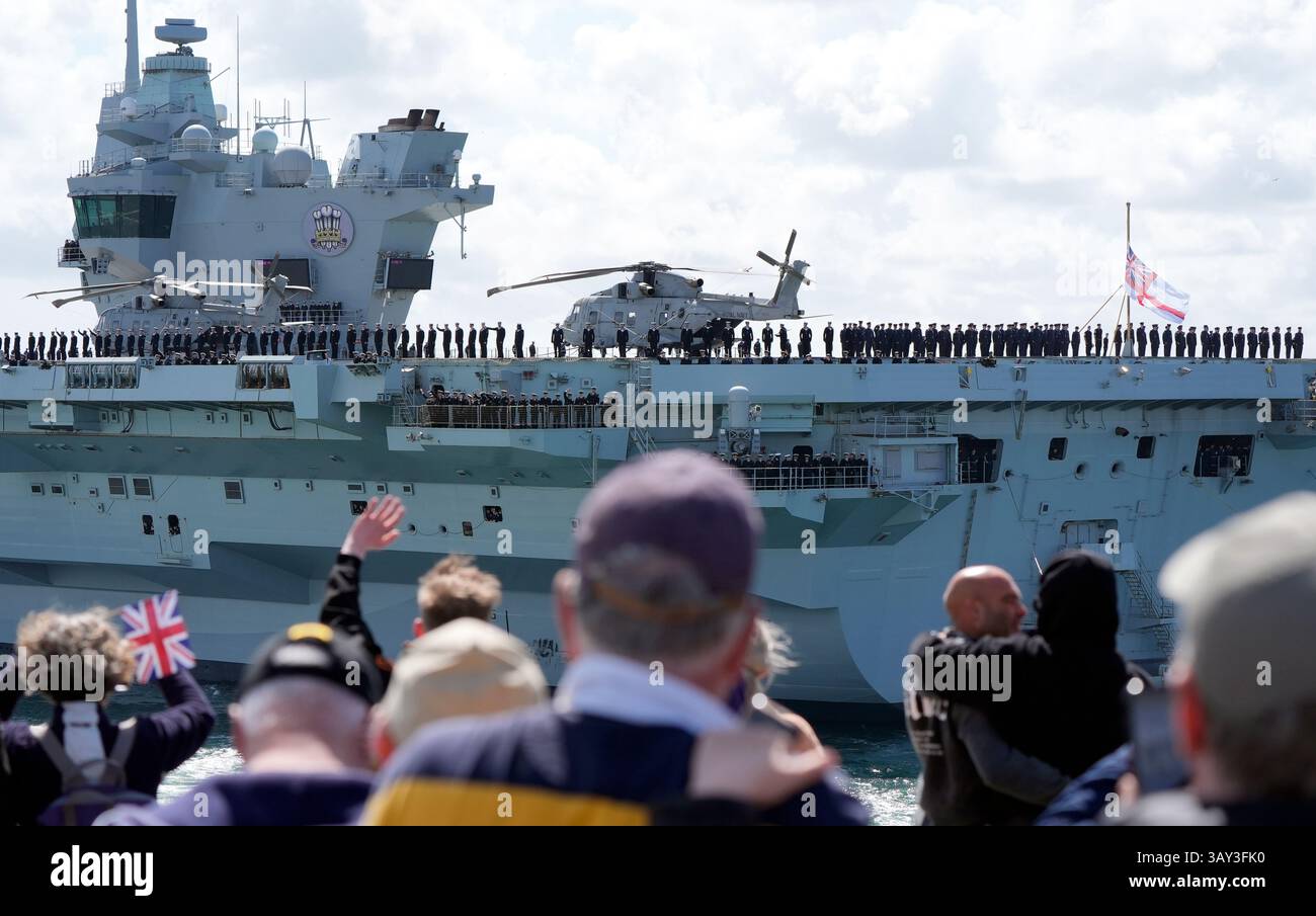 The Royal Navy aircraft carrier, HMS Prince of Wales, sails from ...