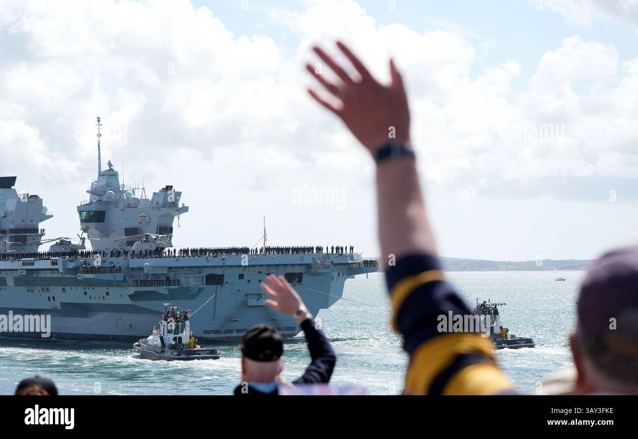 The Royal Navy aircraft carrier, HMS Prince of Wales, sails from ...