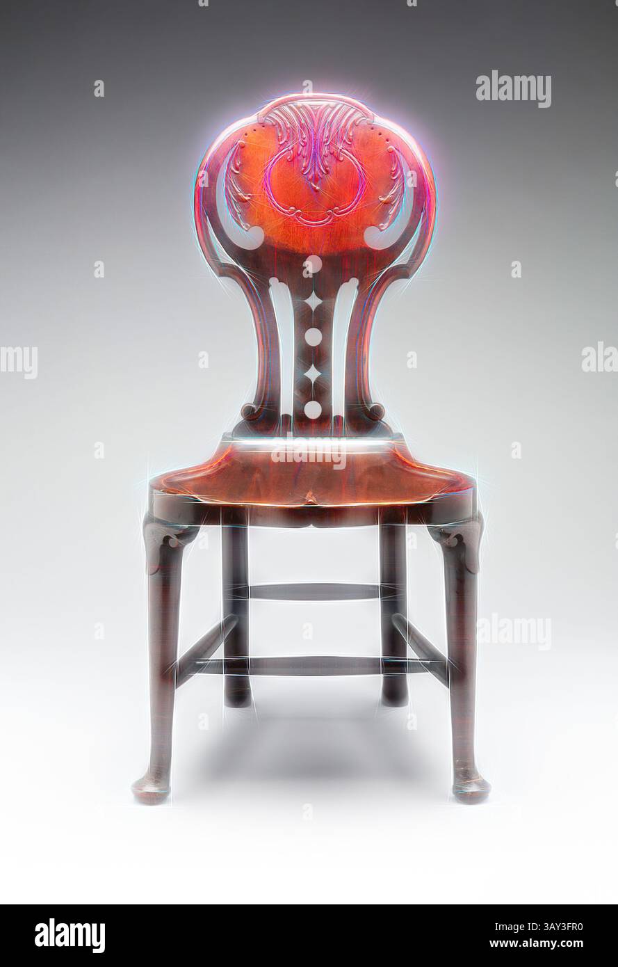 A decorative wooden chair with intricate carvings on the backrest and a ...