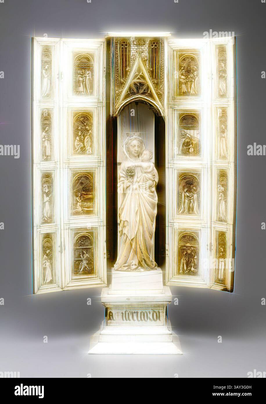 A beautifully crafted altarpiece features a central figurine of a ...