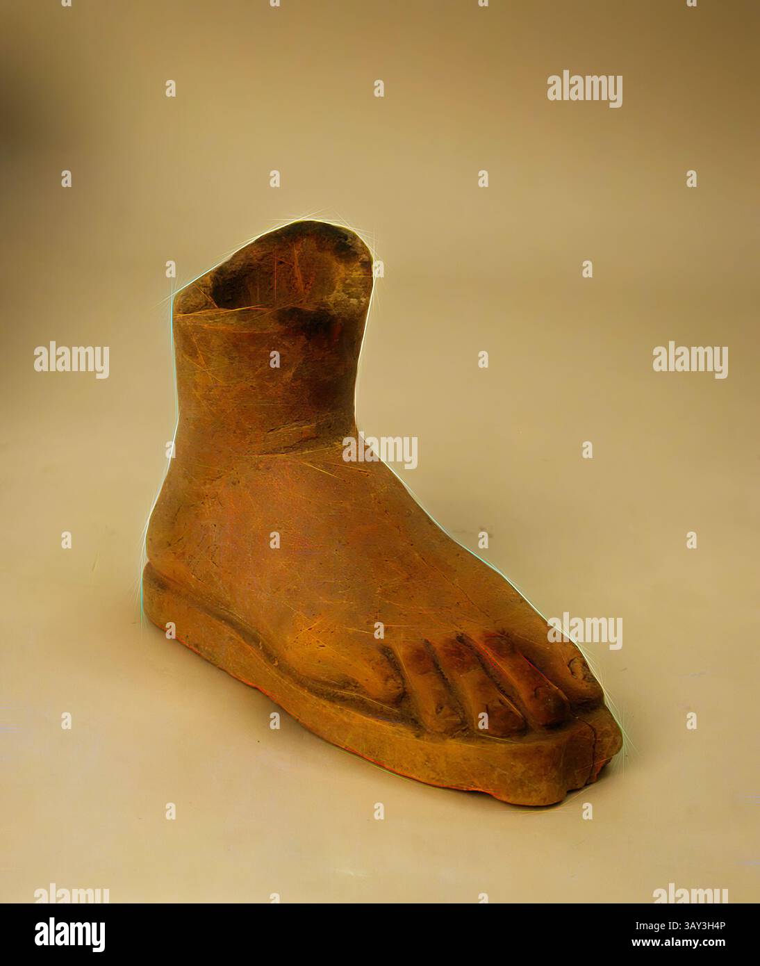 An ancient terracotta sculpture depicting a foot, showcasing detailed ...