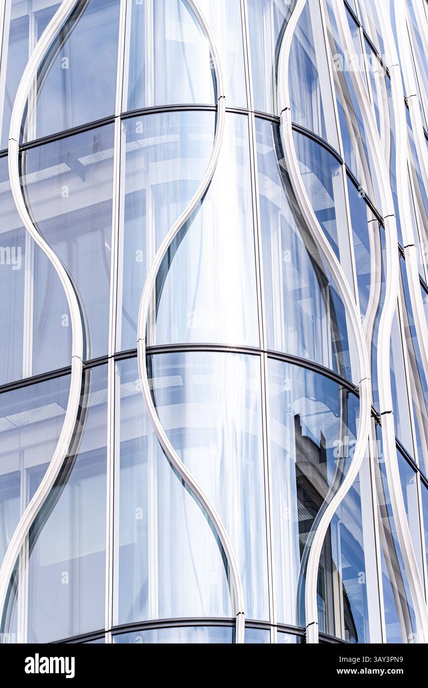 Stunning modern architecture showcasing a sleek, curved glass facade ...