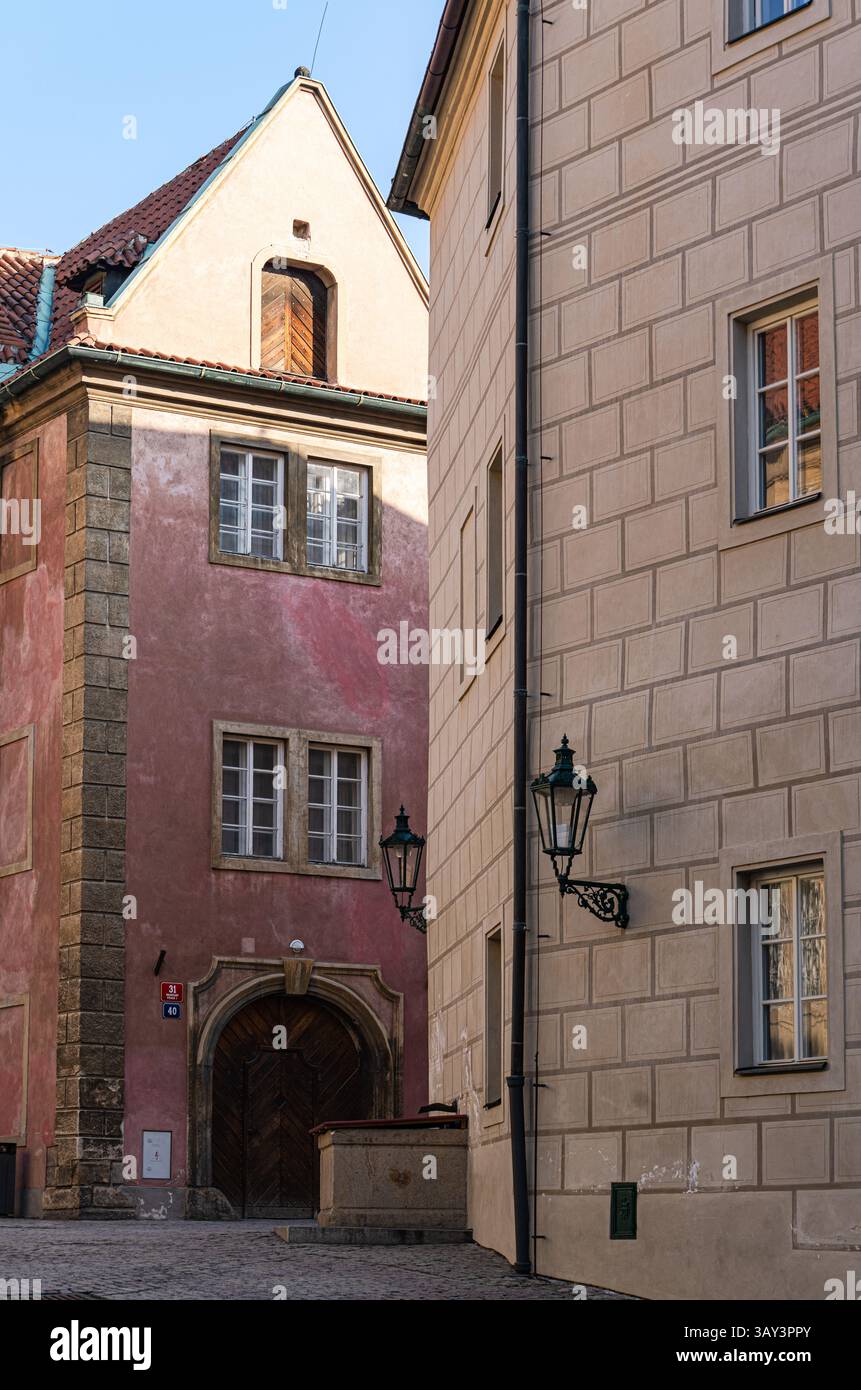 A picturesque view of a narrow alley between historic European ...