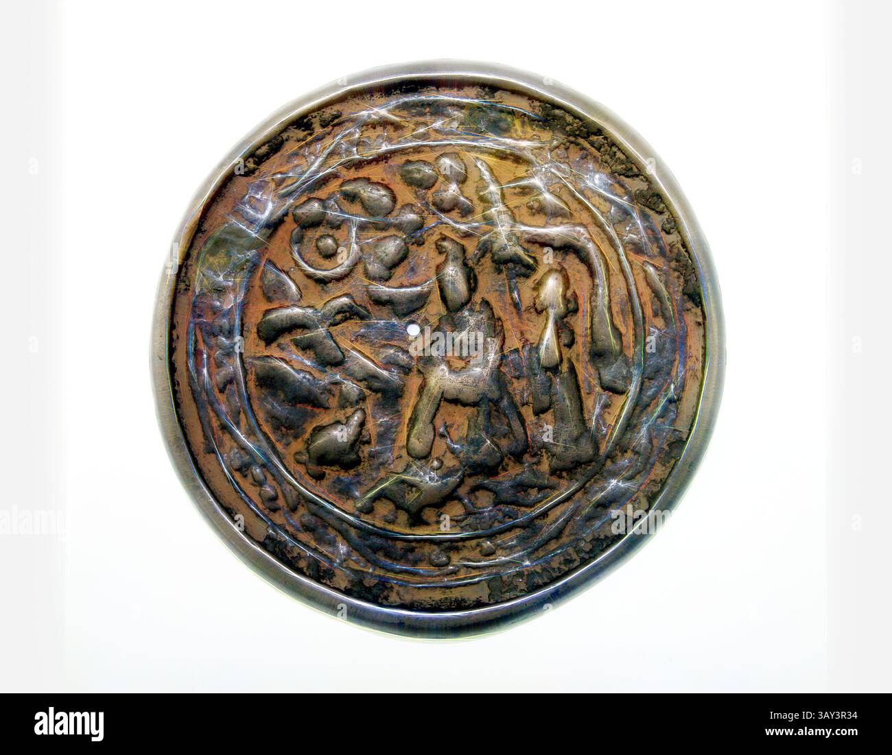 An intricately designed circular piece featuring raised patterns that ...