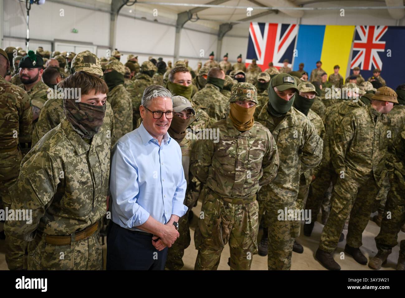 Prime Minister Sir Keir Starmer poses for a photo with troops during a ...