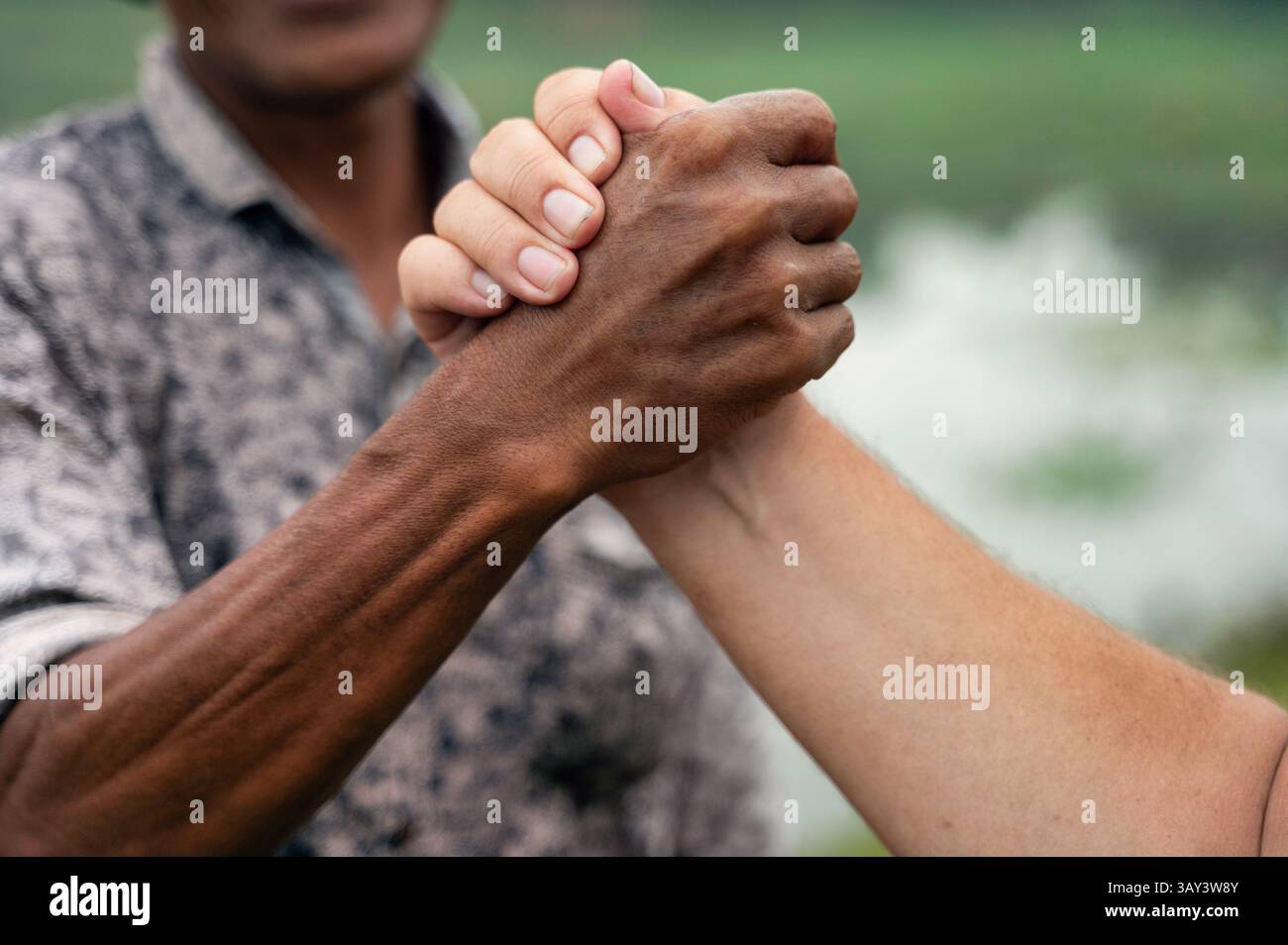 Close-up of two hands clasped together, symbolizing unity and ...