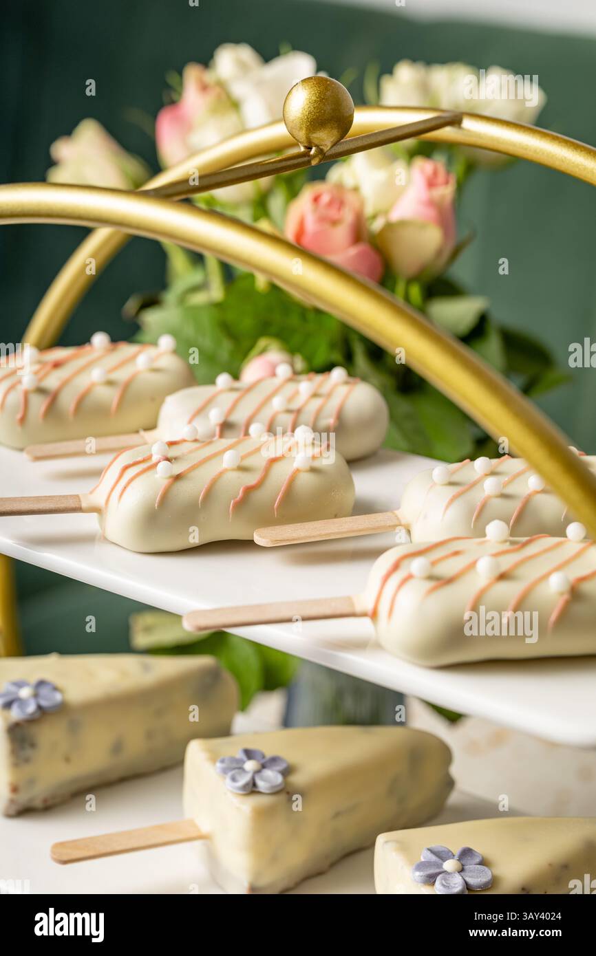 Sweet dessert features chocolate coating hi-res stock photography and ...