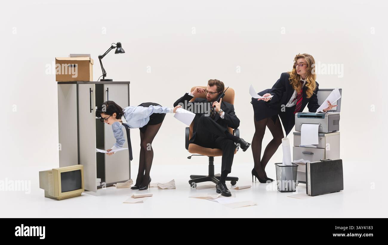 Two women in workplace, handing papers hi-res stock photography and ...