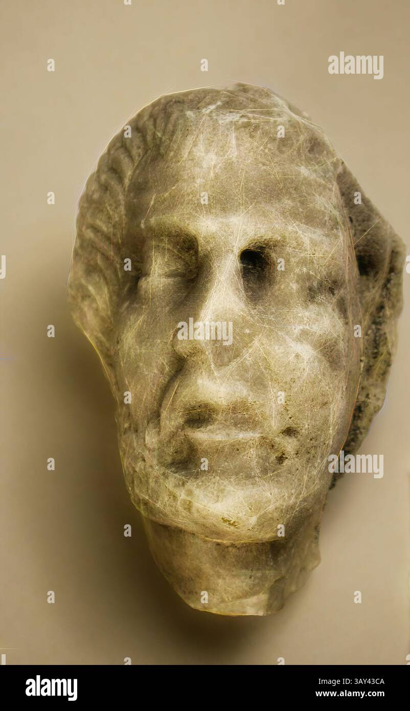 An ancient sculpted head showcasing intricate details of facial ...
