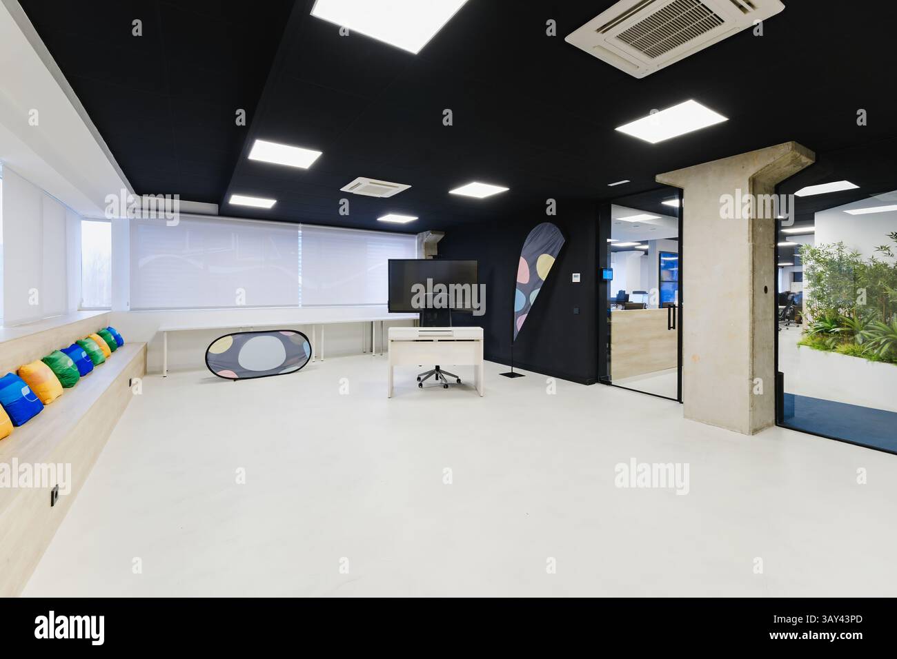 Modern and spacious training room featuring a long bench with colorful ...