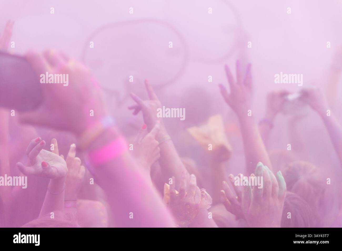 Cropped unrecognizable group of people intensely enjoying the vibrant ...