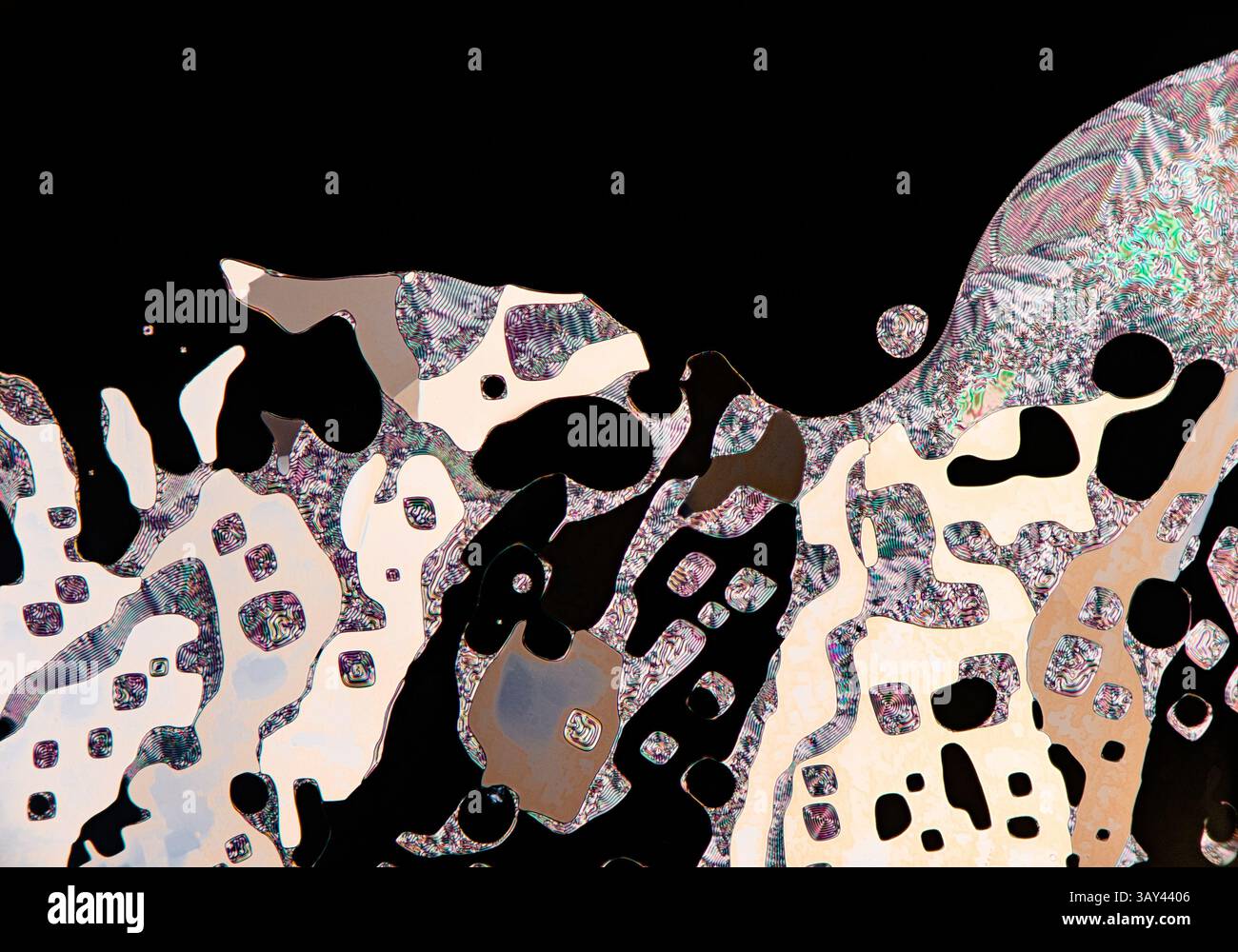 Multicolored display of liquid crystals under the microscope, showing a ...